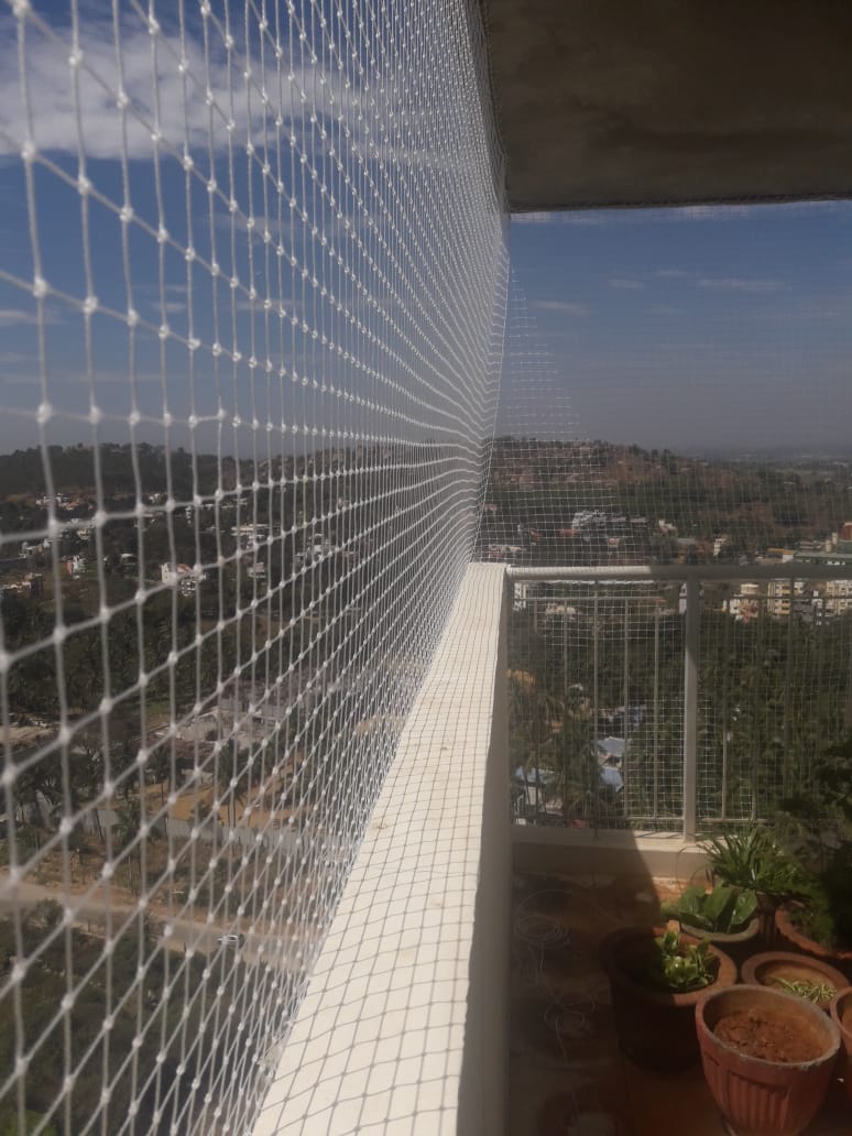 Balcony Netting Secure and Stylish Safety Solutions Pigeon safety nets ...